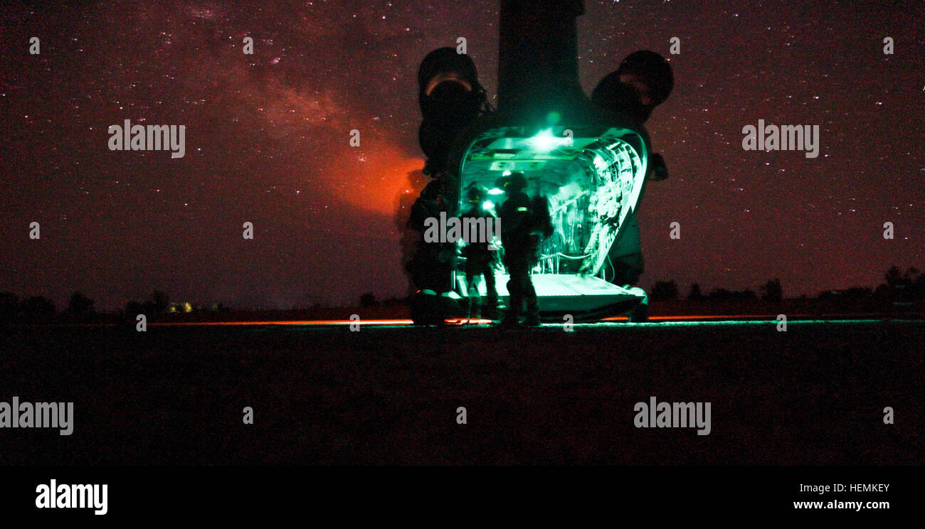 CH-47 Chinook flight crew members conduct preflight checks prior to ...