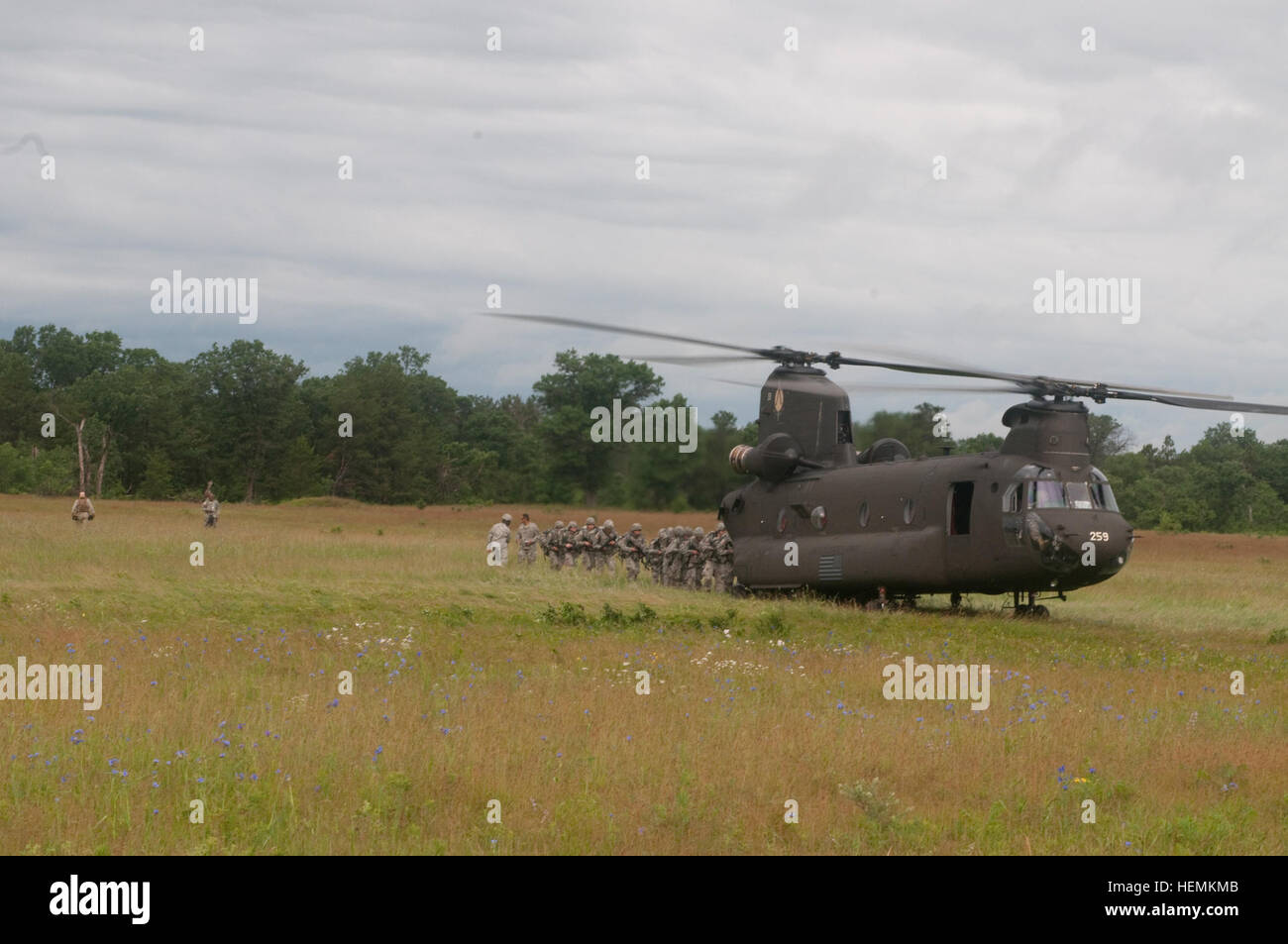 Soldiers load onto a Chinook helicopter as part of an event for the ...
