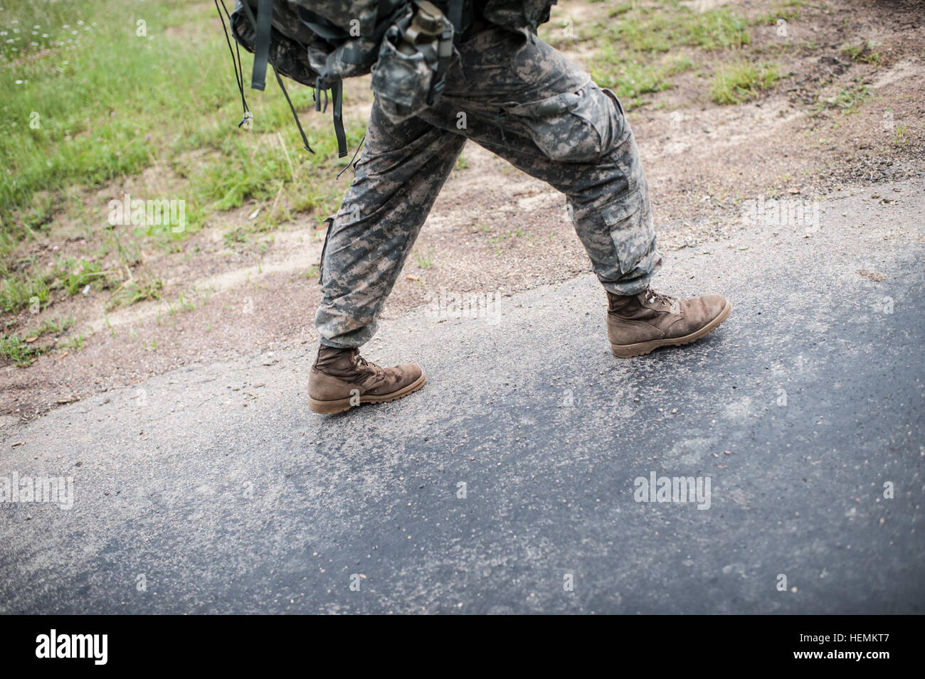 An Army Reserve Best Warrior candidate negotiates a steep incline ...