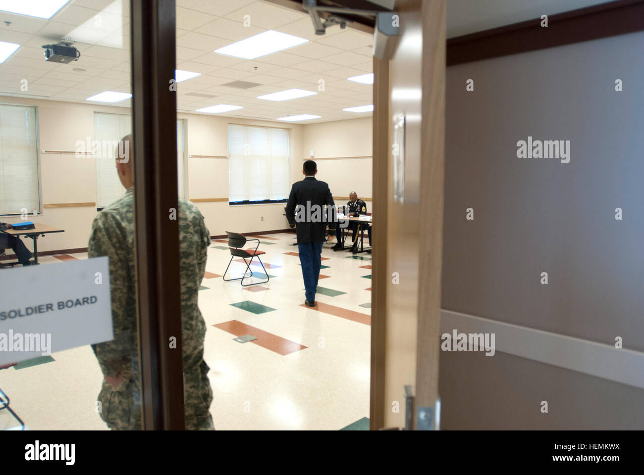 U.S. Army Spc. Muhammad Ali, 3rd Medical Command, enters a room to ...