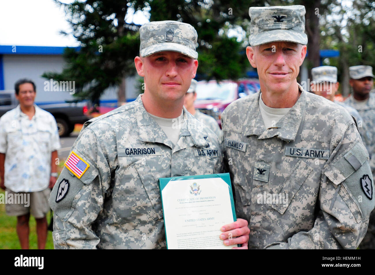 U.S. Army Master Sgt. Travis Garrison, left, an operations ...