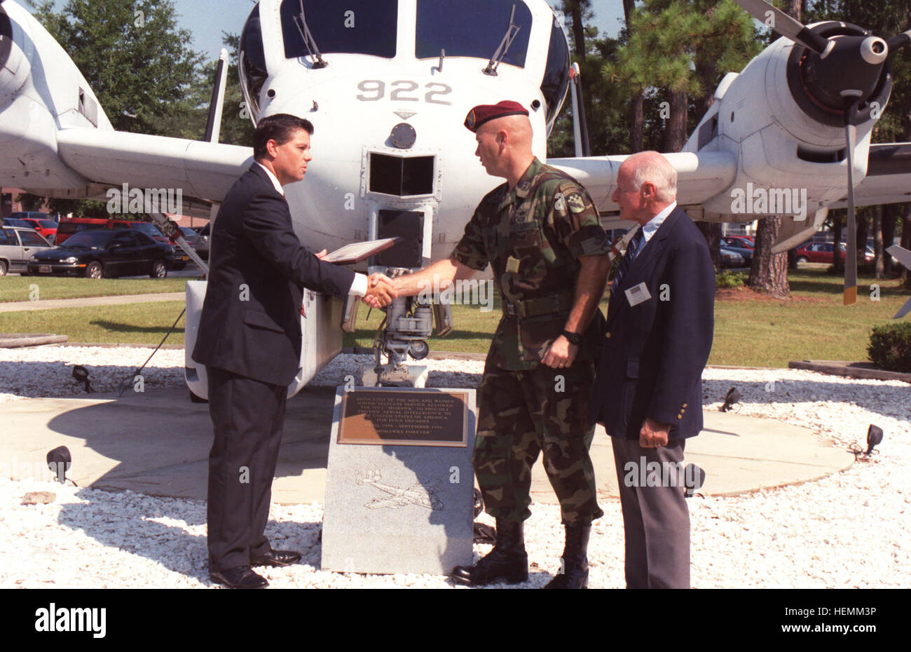 Dignitaries shake hands during the retirement ceremony for OV-1 Mohawk ...