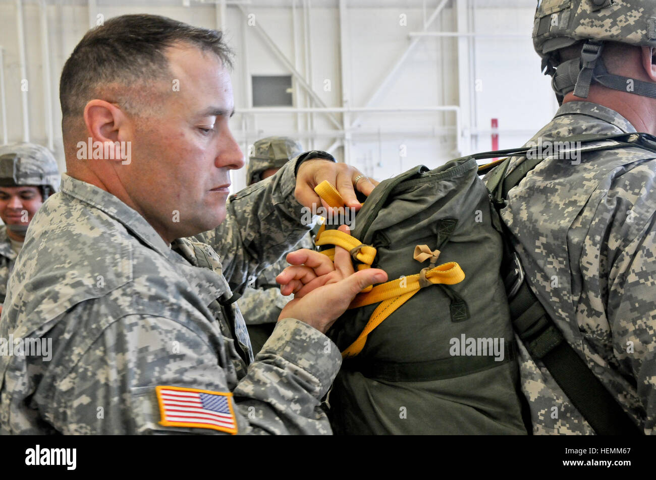 U.S. Army Master Sgt. Bradley Buechner, left, with Headquarters Company ...