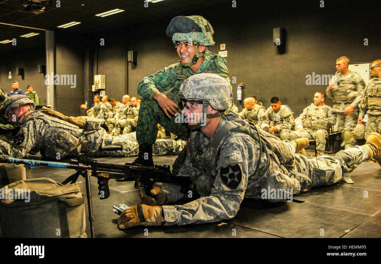 U.S. Army Spc. Benjamin Seidell, right, a squad designated marksman ...
