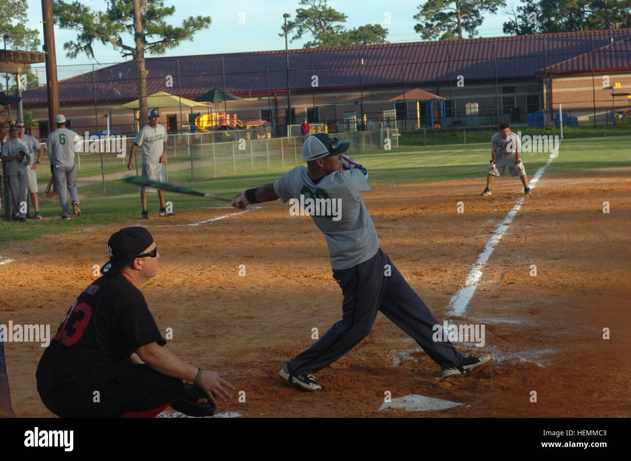 Spc. Mario Coronado, 385th MP Bn.'s shortstop, takes a swing during the ...
