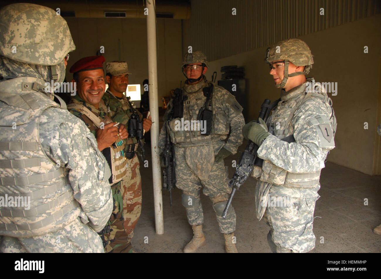U.S. Army Capt. Brian McCall, commander, and U.S. Army 1st Lt. Neal ...