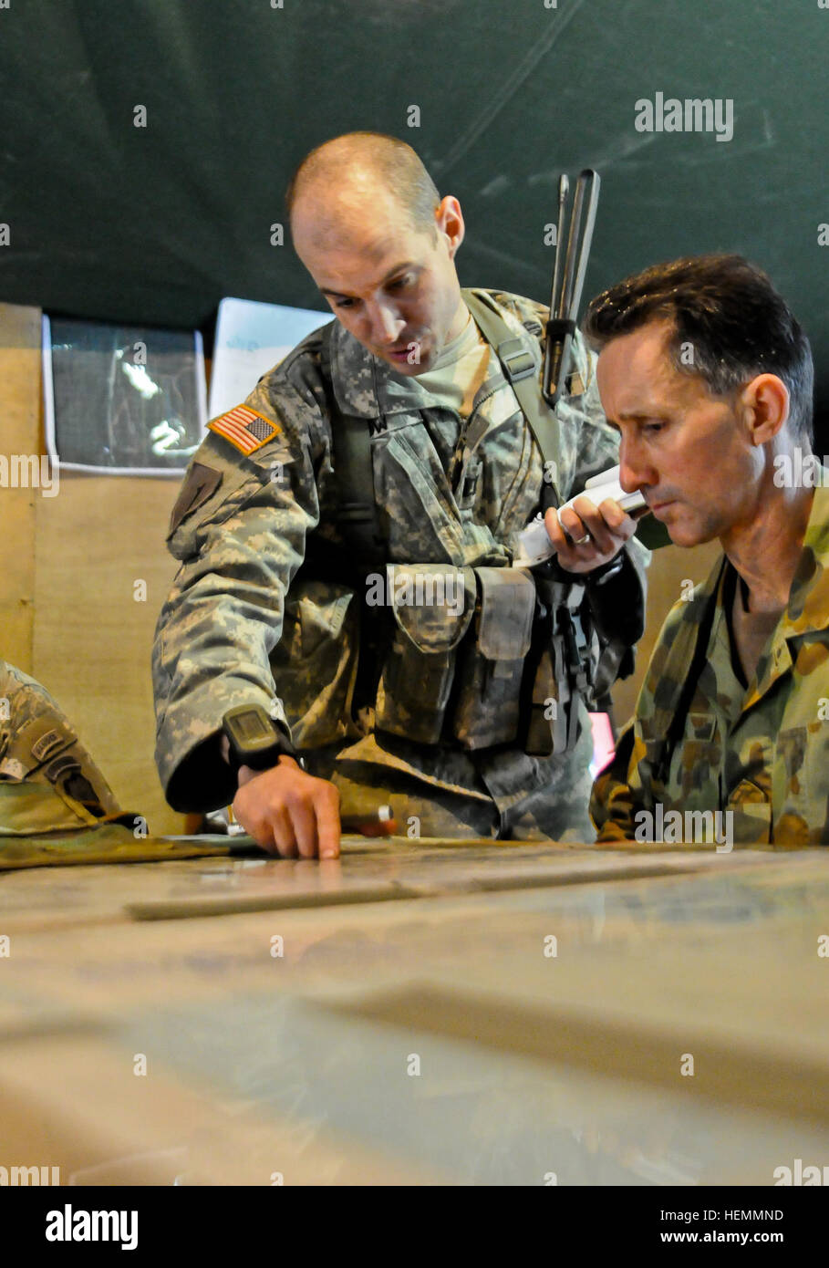 U.S. Army Capt. Ross Low, left, battle captain for Task Force Spartan ...
