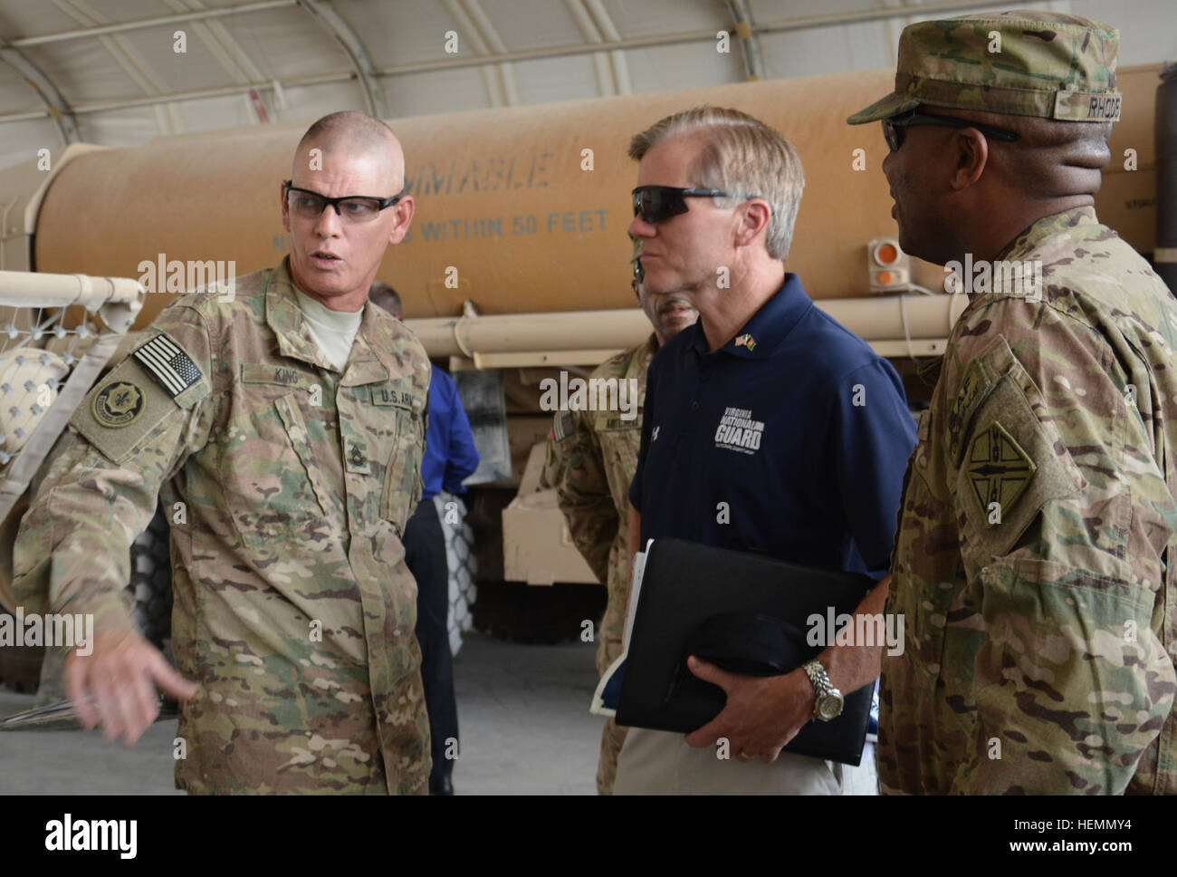 U.S. Army Sgt. First Class Albert King shows Virginia Governor Robert F ...