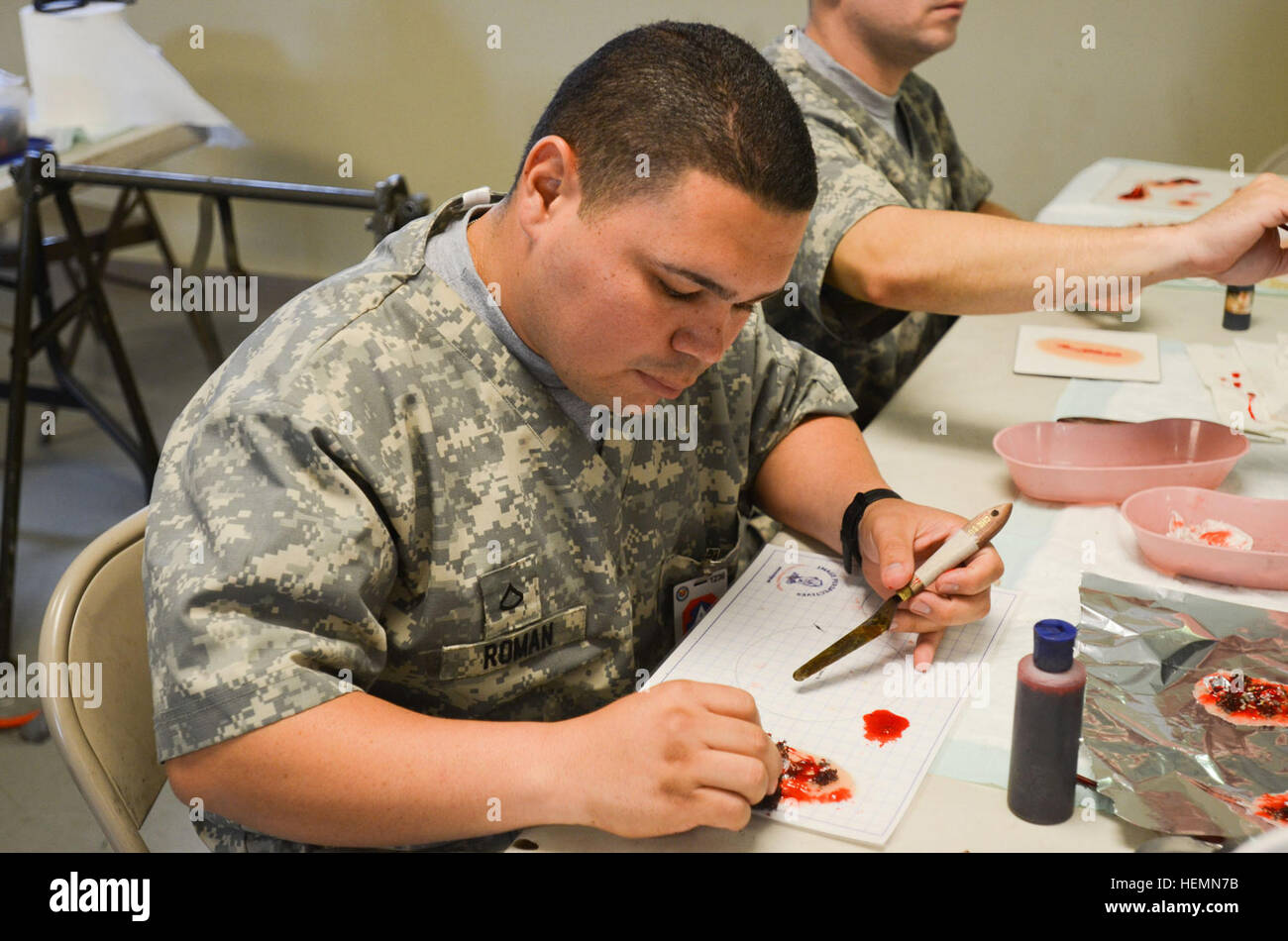 U.S. Army Pfc. Jose Roman, a mortuary affairs specialist assigned to ...