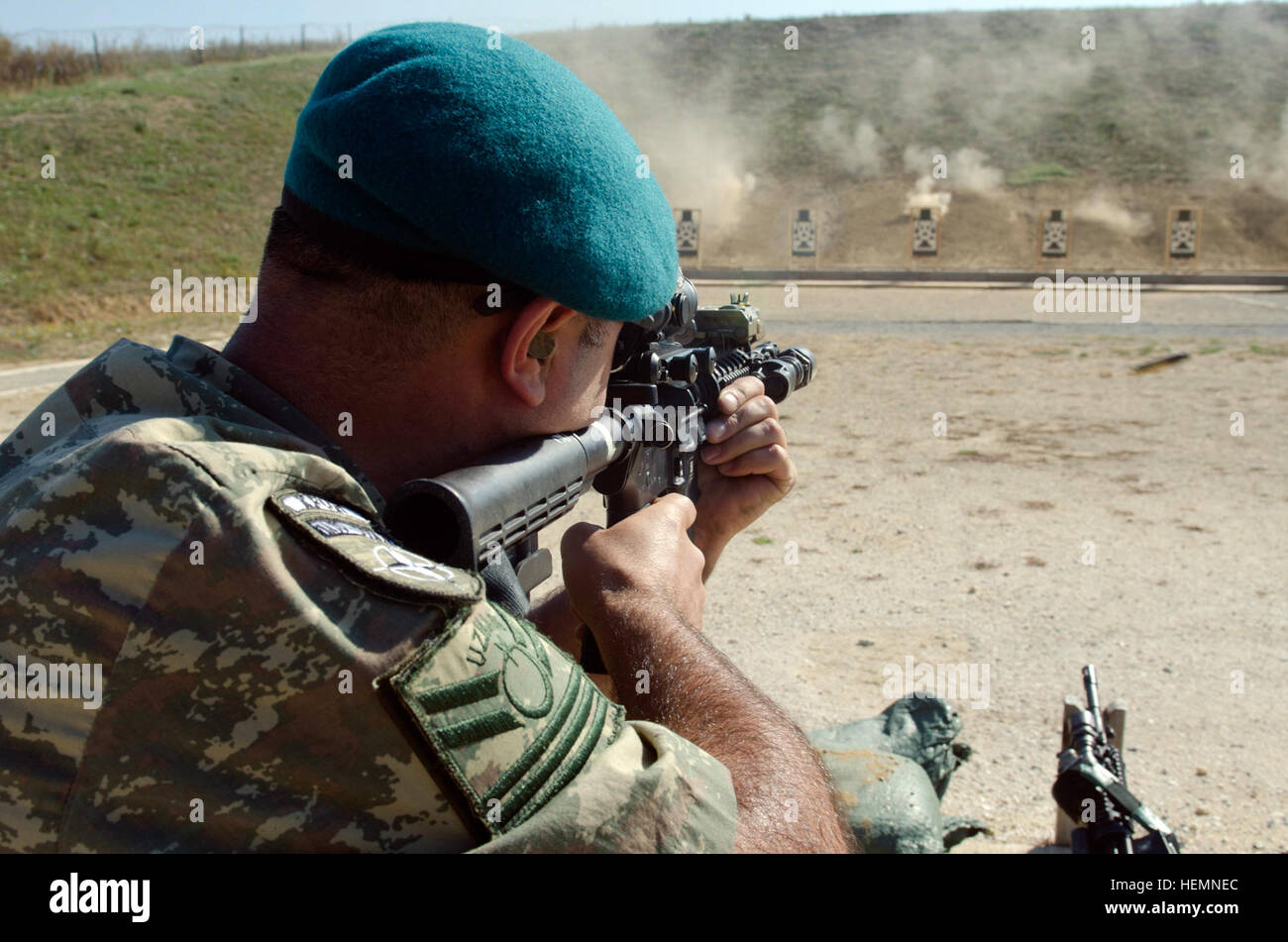 A Turkish Army soldier fires a round at a 25-meter target while in the ...