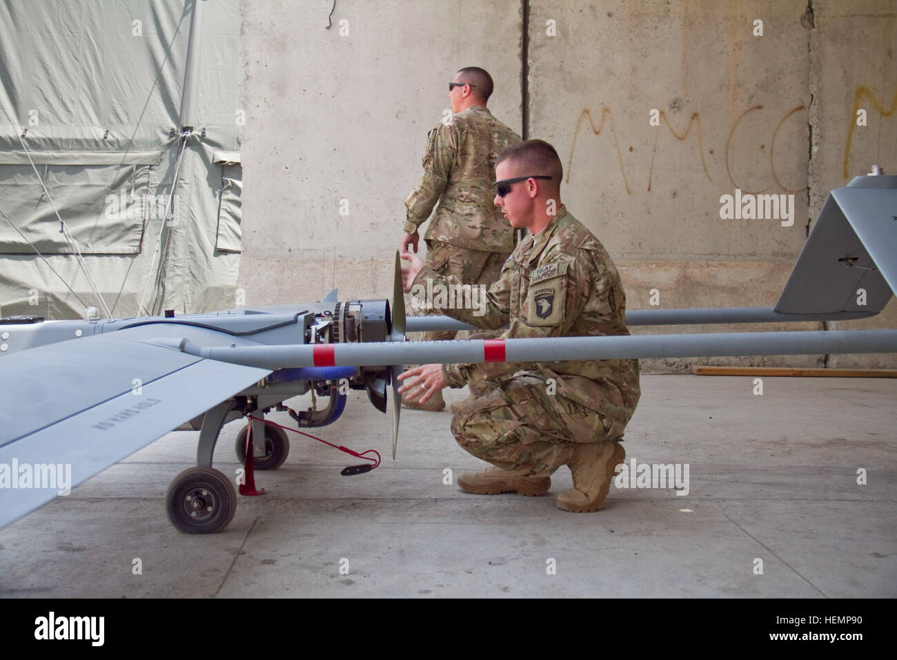 U.S. Army personnel operate an AAI RQ-7 Shadow unmanned aerial vehicle ...