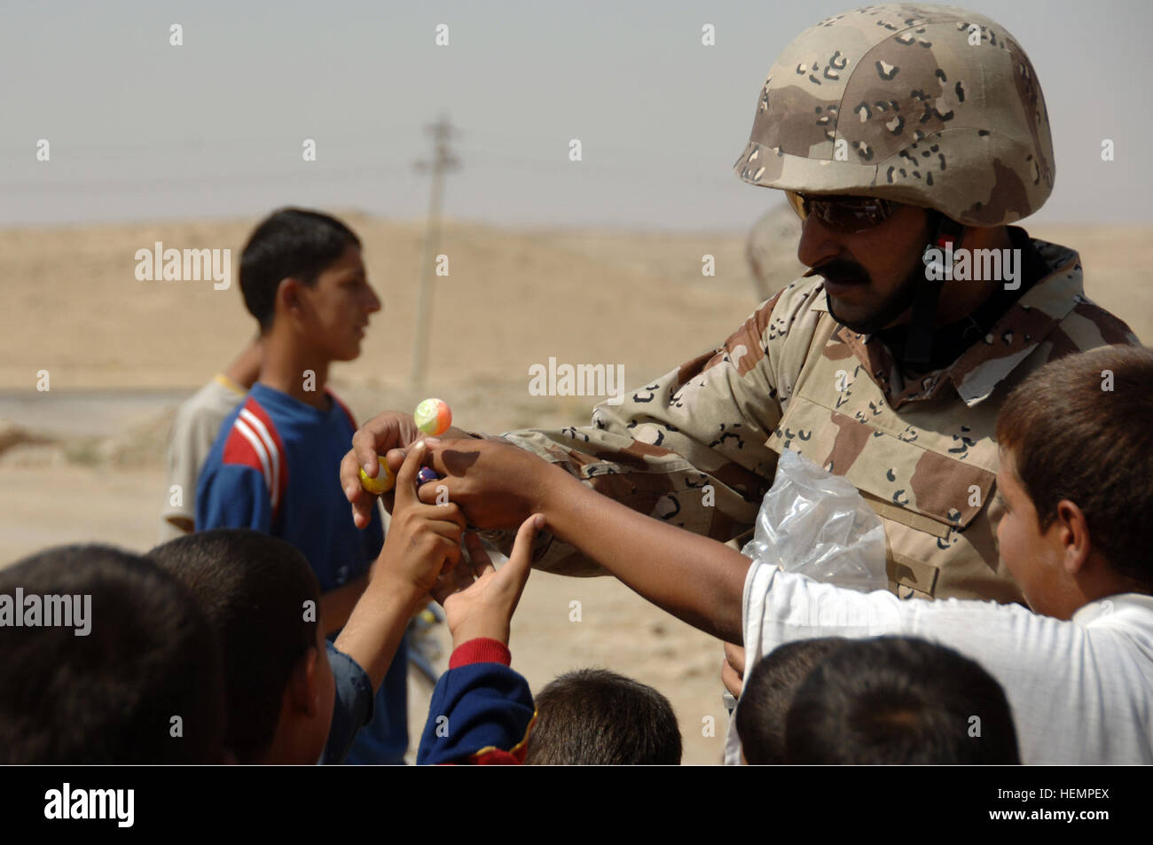 A small bag of bouncy balls in the hands of an Iraqi army soldier from ...