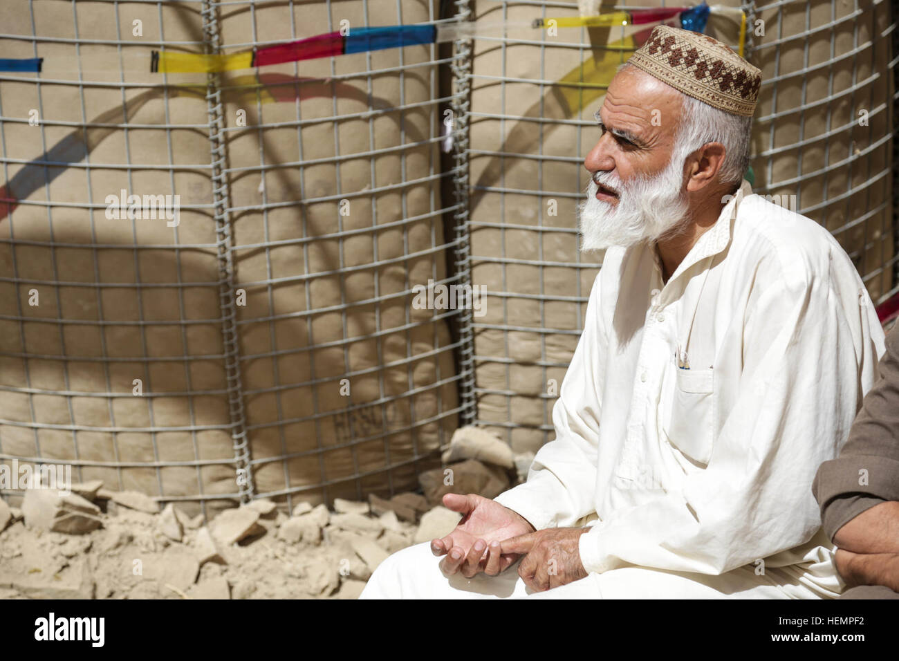 A local Afghan doctor provides feedback to U.S. Army Cpt. Shani ...