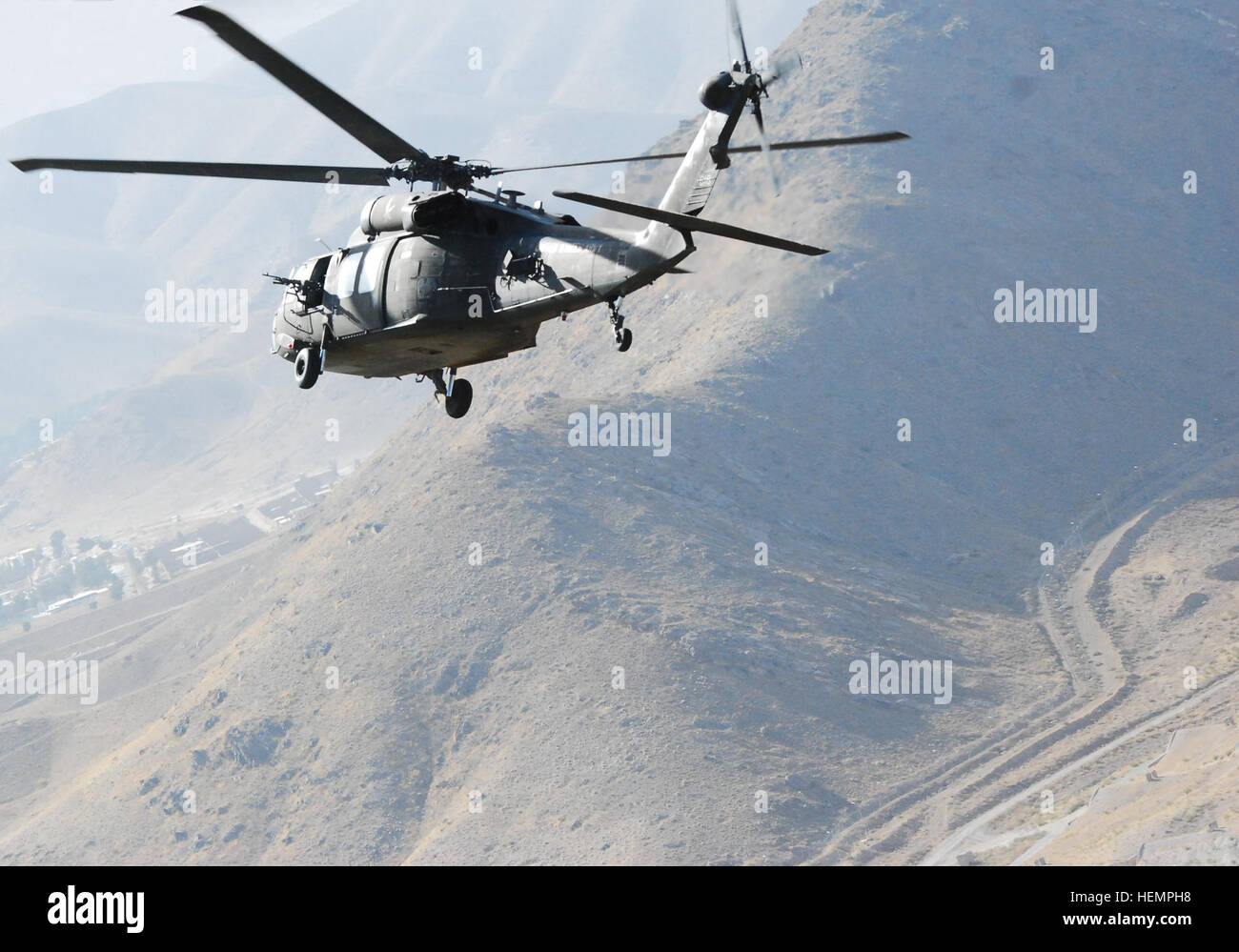 A UH-60L Black Hawk helicopter crewed by 1st Lt. Chuck Nadd, Chief ...