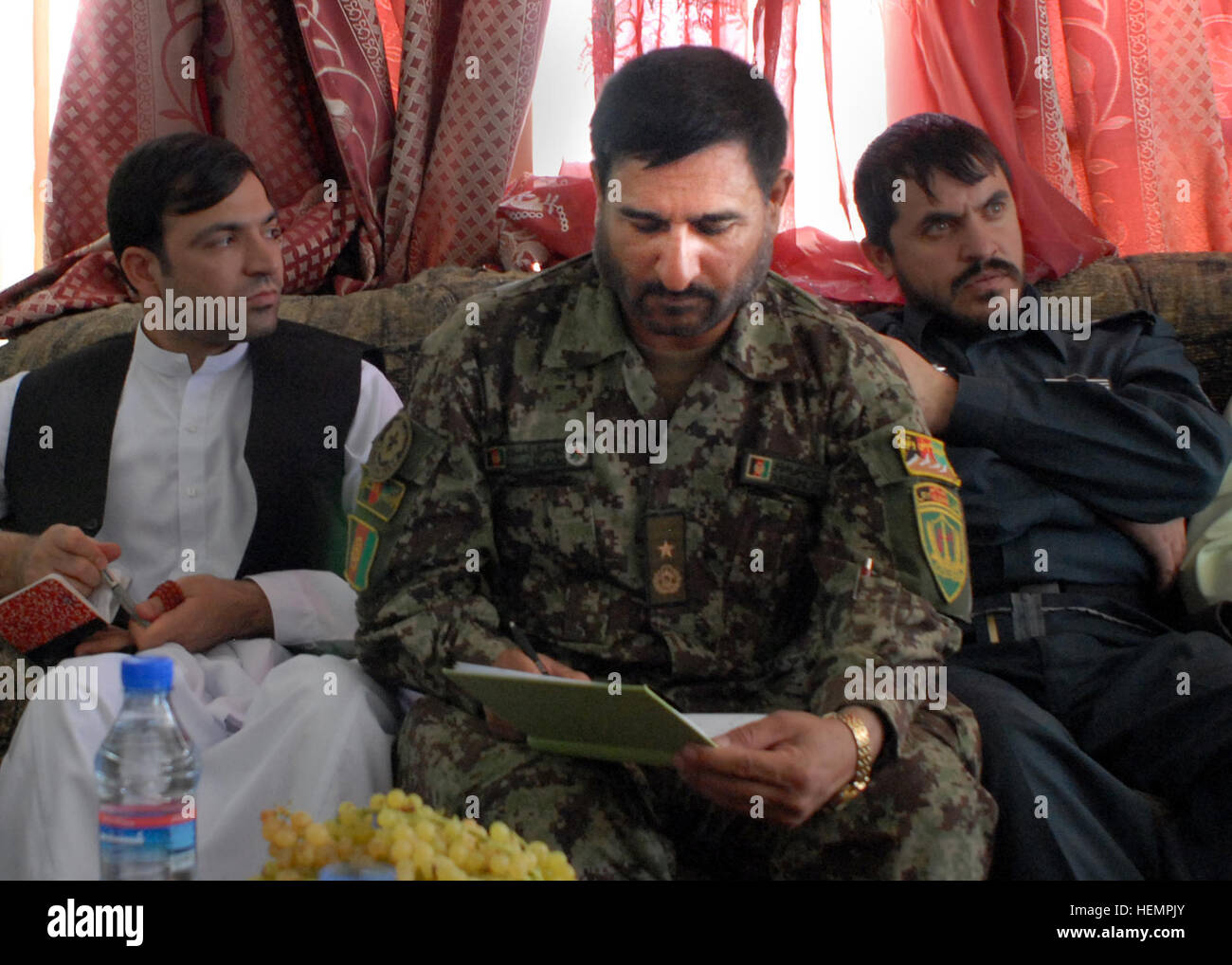 Brig. Gen. Ahmed Habibi gathers his thoughts before addressing district ...