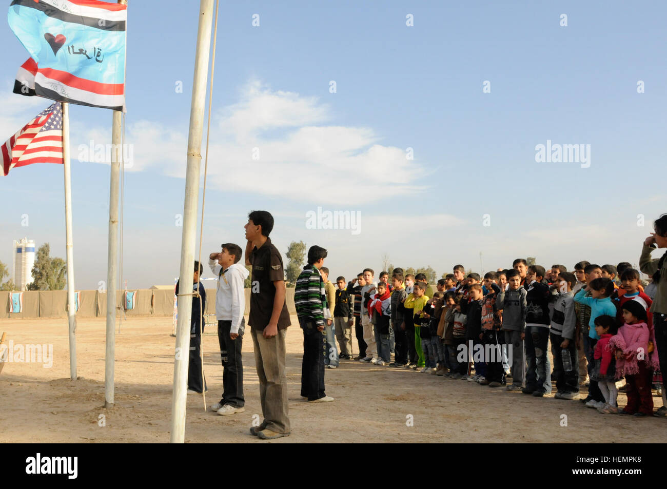 Iraqi Boy Scouts and Girl Guides salute there flag and sing there ...