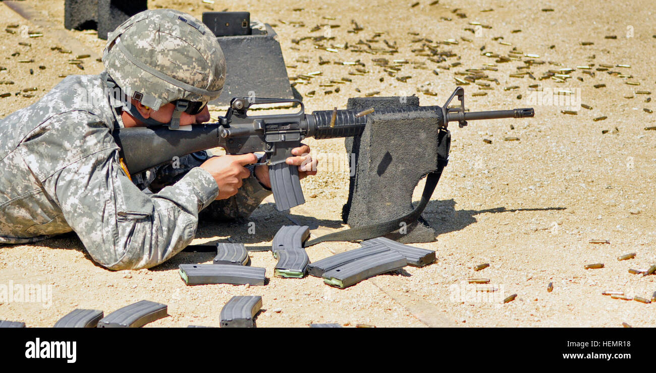 A U.S. Army Reserve Soldier with the 11th Military Police Brigade fires ...