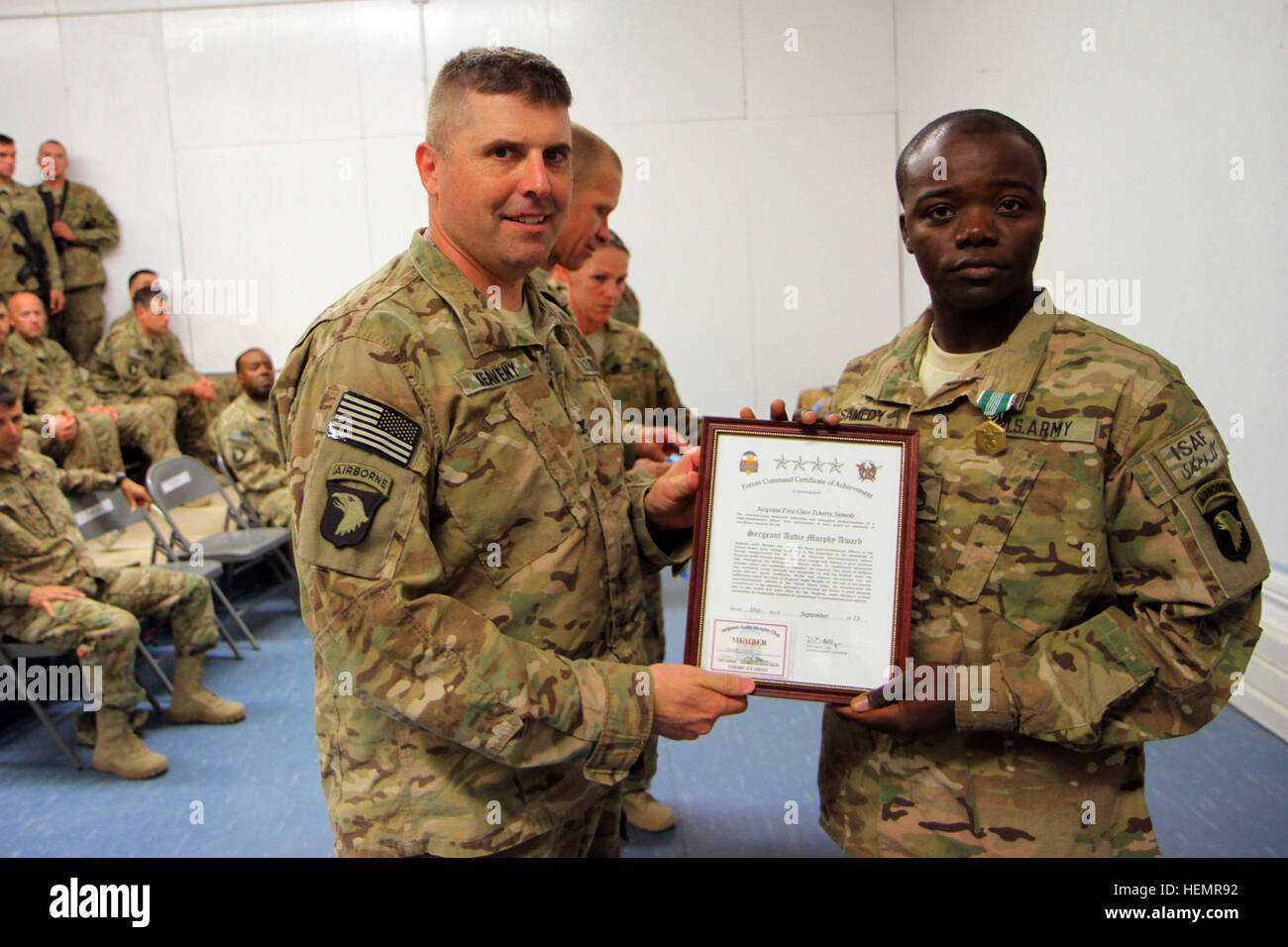U.S. Army Sgt. 1st Class Tcherry Samedy (right), a Soldier with the ...