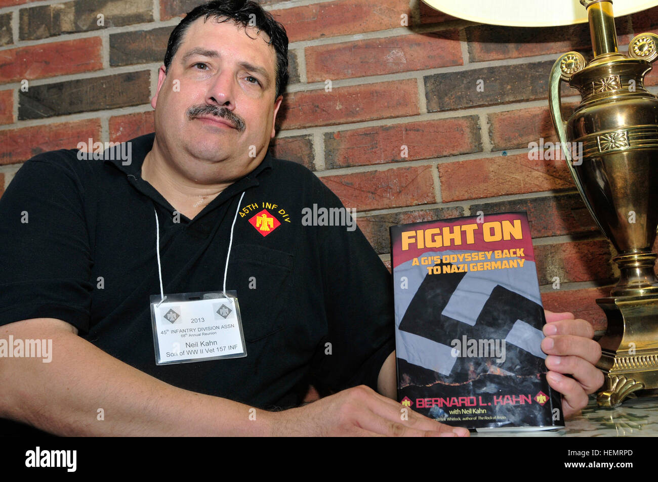 Neil Kahn, son of 45th Infantry Division veteran Bernard Kahn, displays ...