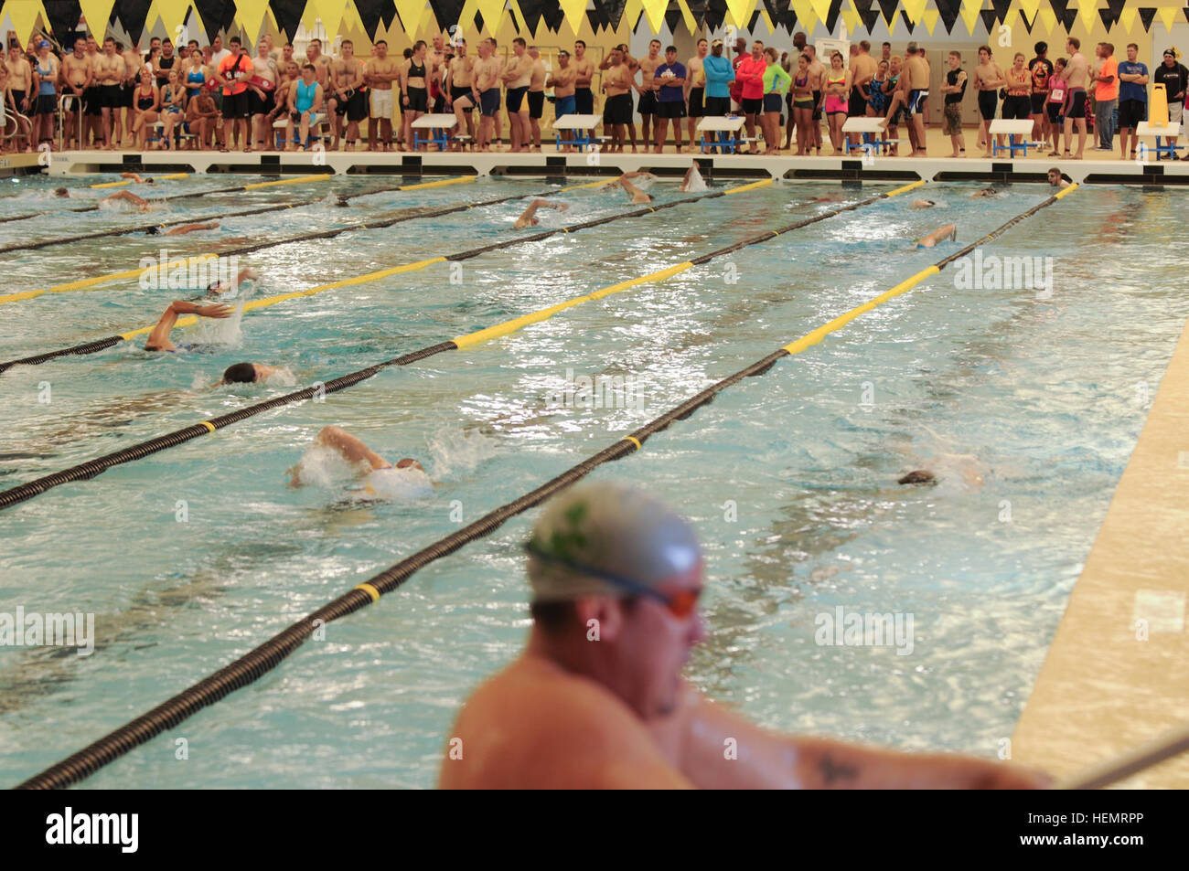 Soldiers participate in the 400-meter swim segment of the Iron Soldier ...