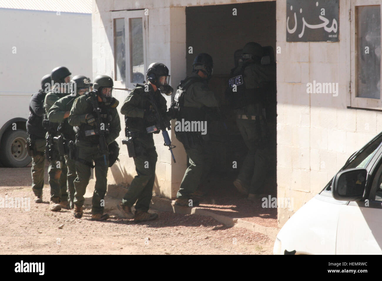 Members of the Fort Carson police Special Reaction Team storm a ...