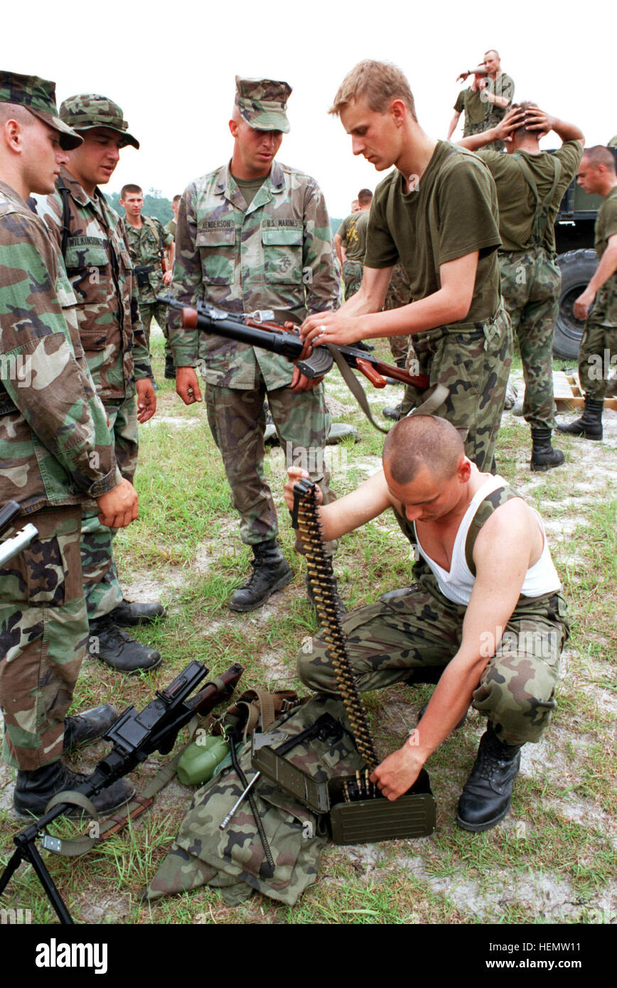 980605-A-3810A-013 Two Polish soldiers show a group of Marines their ...