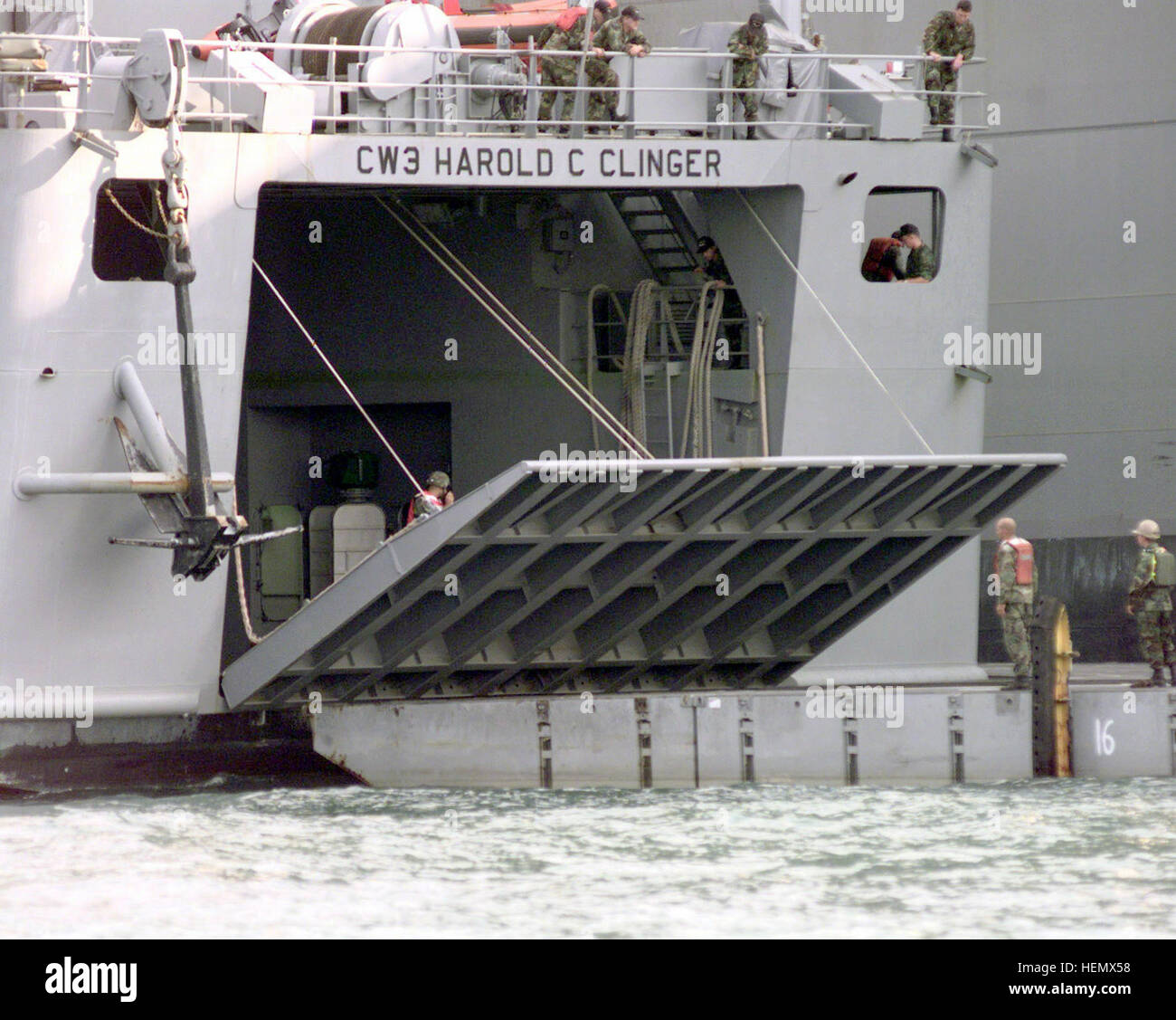 The CW3 Harold C. Clinger, a U.S. Navy Logistic Support Vessel, lowers ...