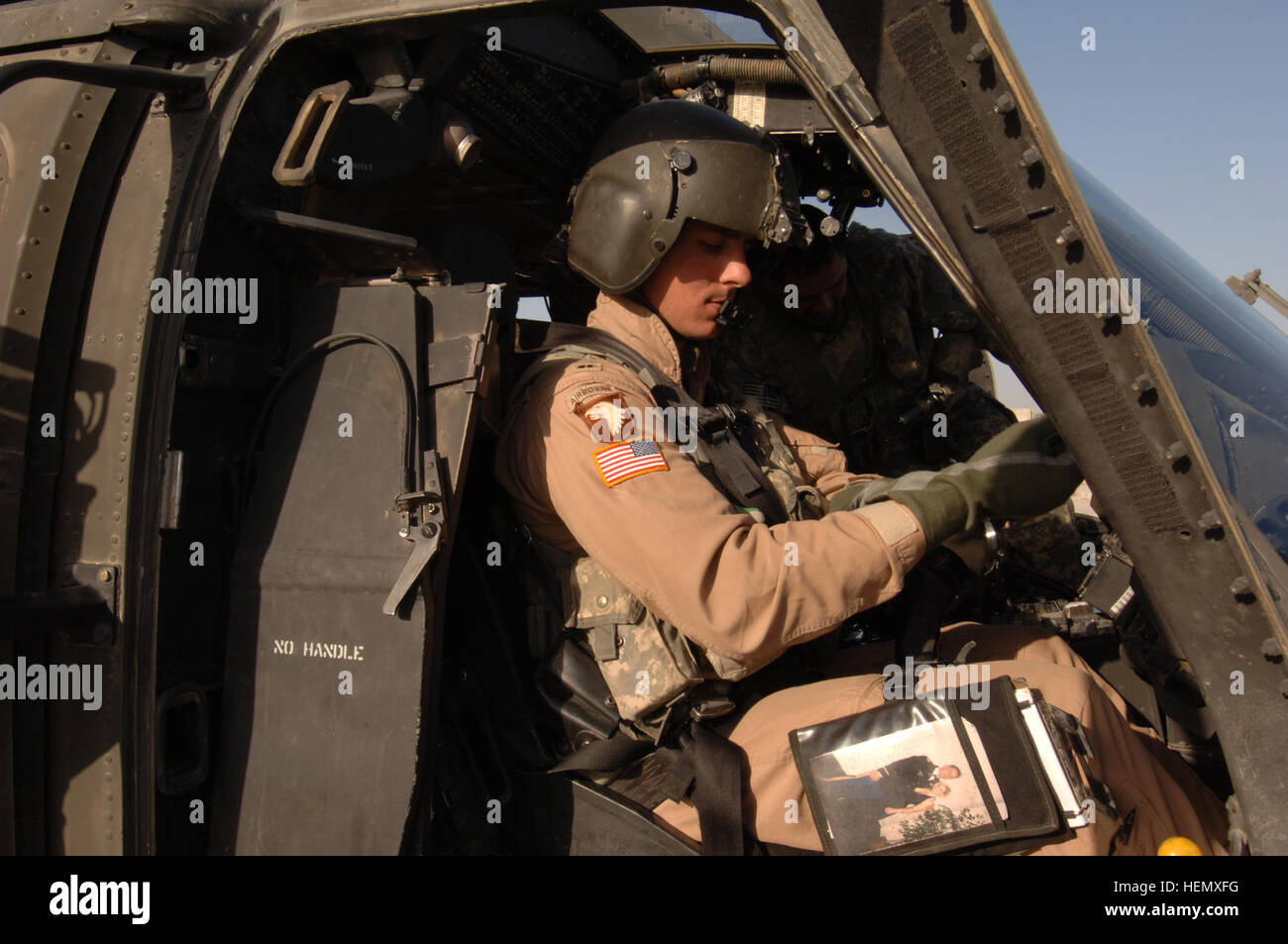Helicopter pilots prepare to takeoff, on Nov. 4, in Yusifiya, Iraq. The ...