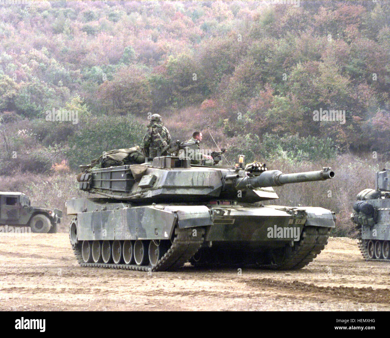 A M1A1 (Abrams Main Battle Tank) enters the Twin Bridges training area ...