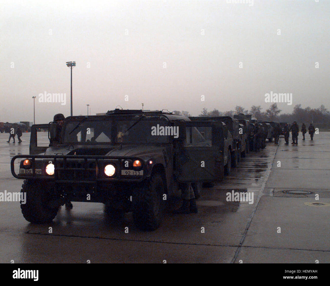 Vehicles from the 18th Millitary Police Battalion wait in line to be ...