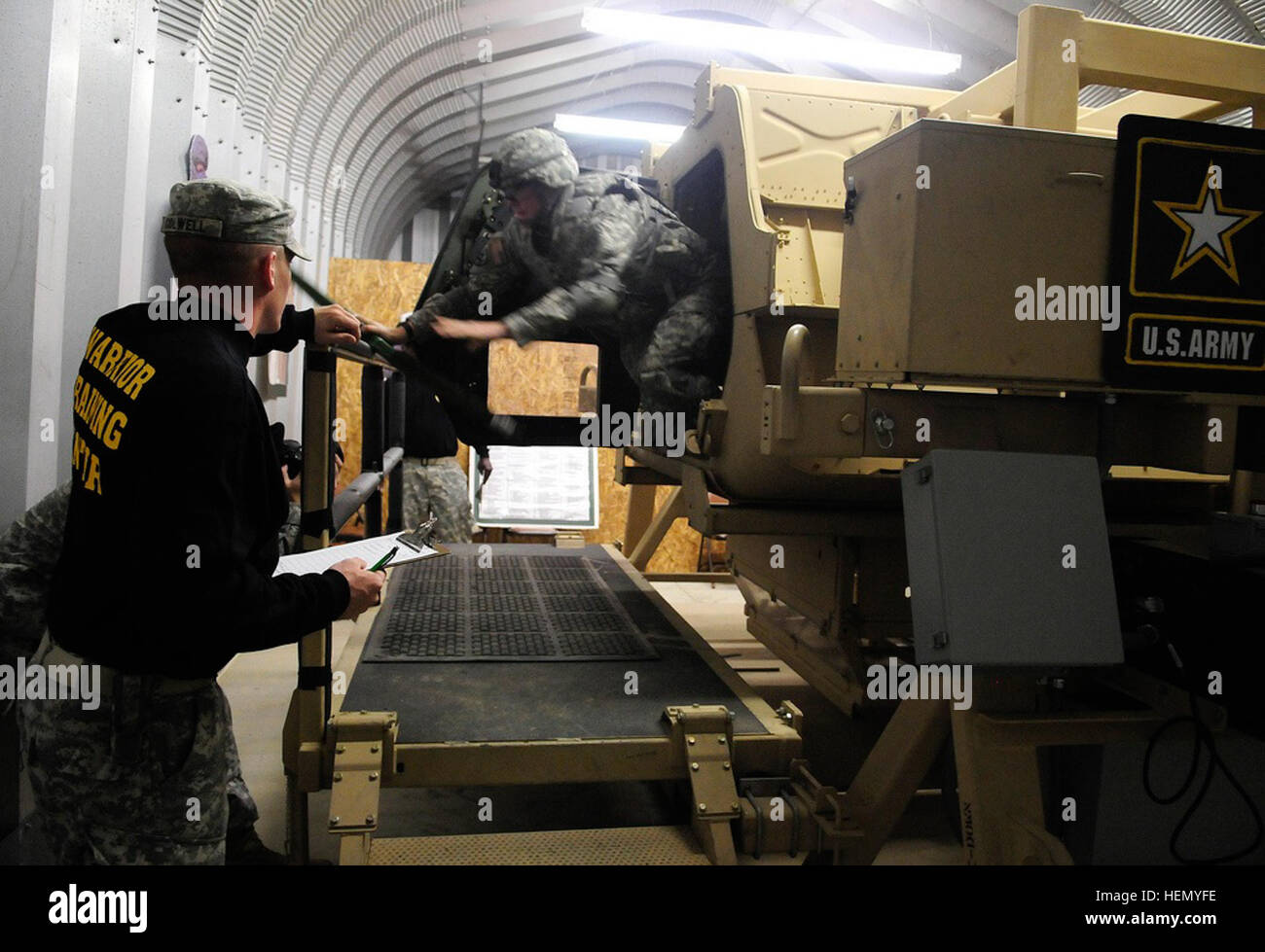 Staff Sgt. Aaron Butler exits the Humvee Egress Assistance Trainer ...