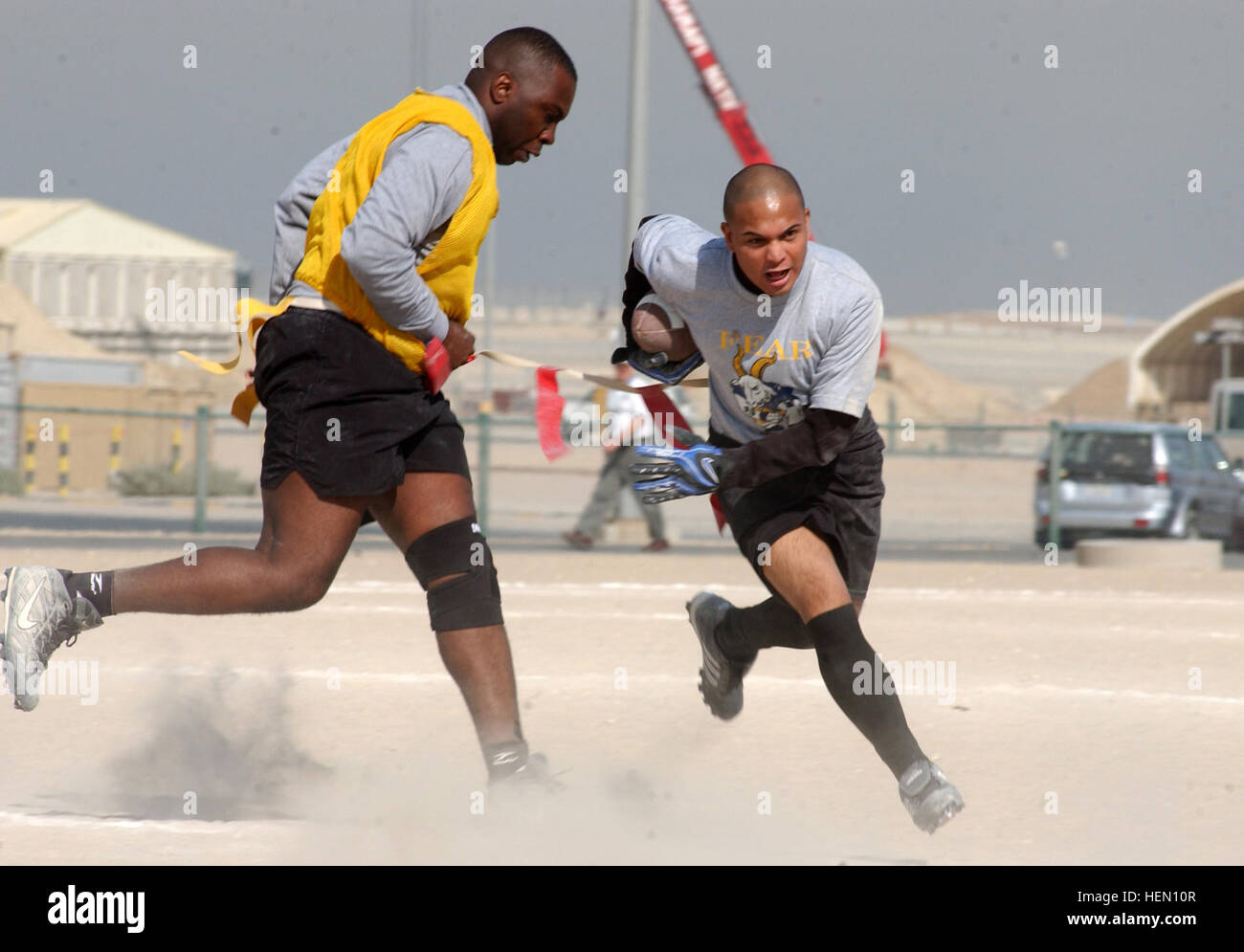 An Army defender de-flags a member of the Navy offense just past the 40 ...