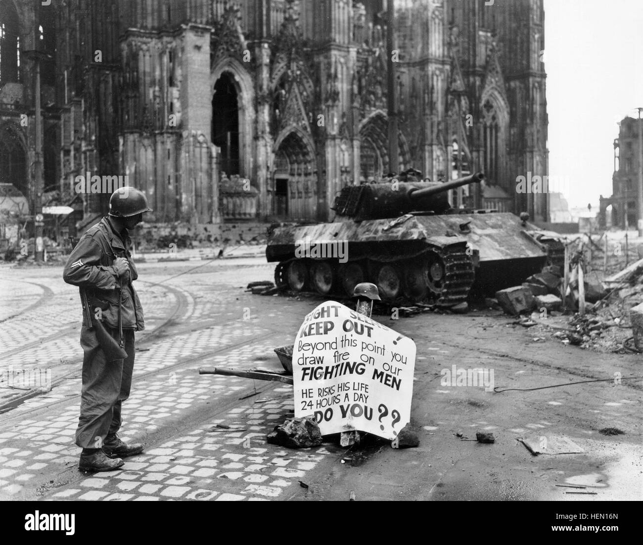 A warning sign posted in Cologne, Germany, conveying safety information ...