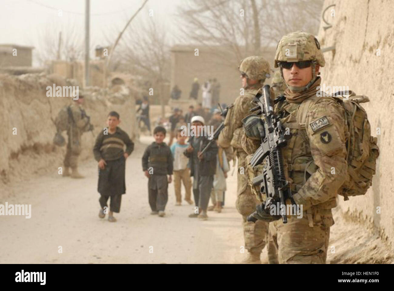 Afghan village patrol Stock Photo - Alamy