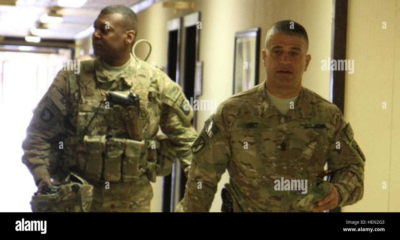 CSM Hector J. Font, commando sergeant major of 2/10 SFAB (right) escorts CSM Alonzo Smith ...