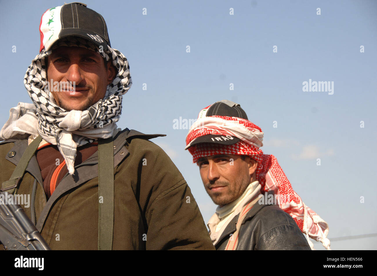 Two Iraqi Concerned Local Citizens wear their signature Iraq hats ...