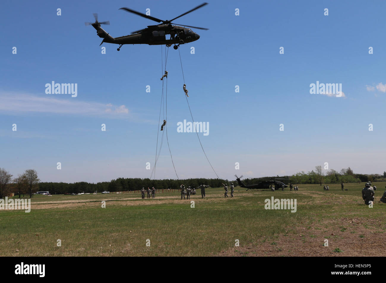 Students of the Fort Drum Air Assault School repel from a UH-60M Black ...