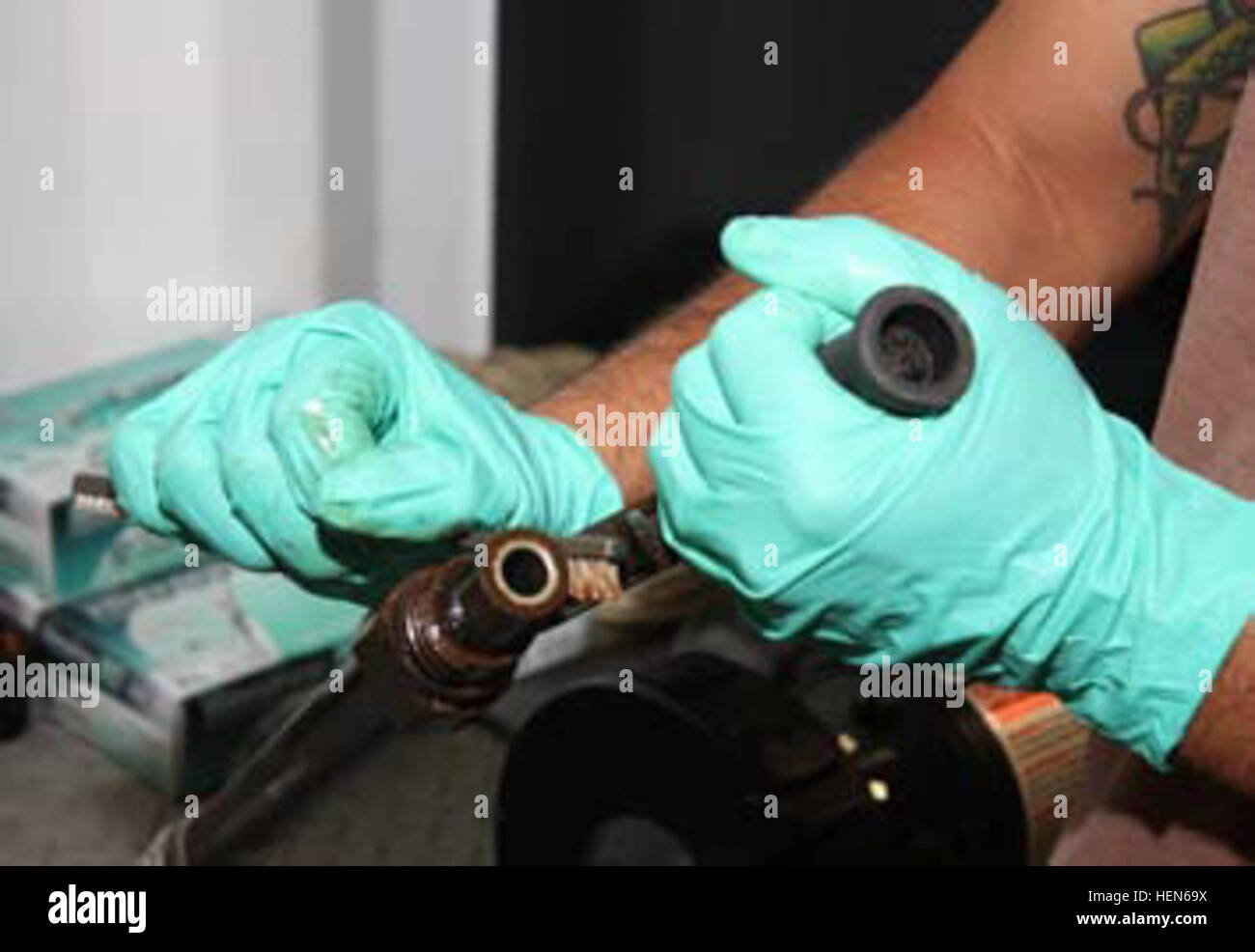 USCG maintenance of a machines gun, Guantanamo -b Stock Photo - Alamy