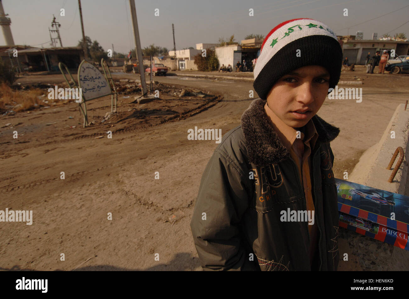A young Iraqi boy watches as U.S. Army Soldiers from Red Platoon, Baker ...