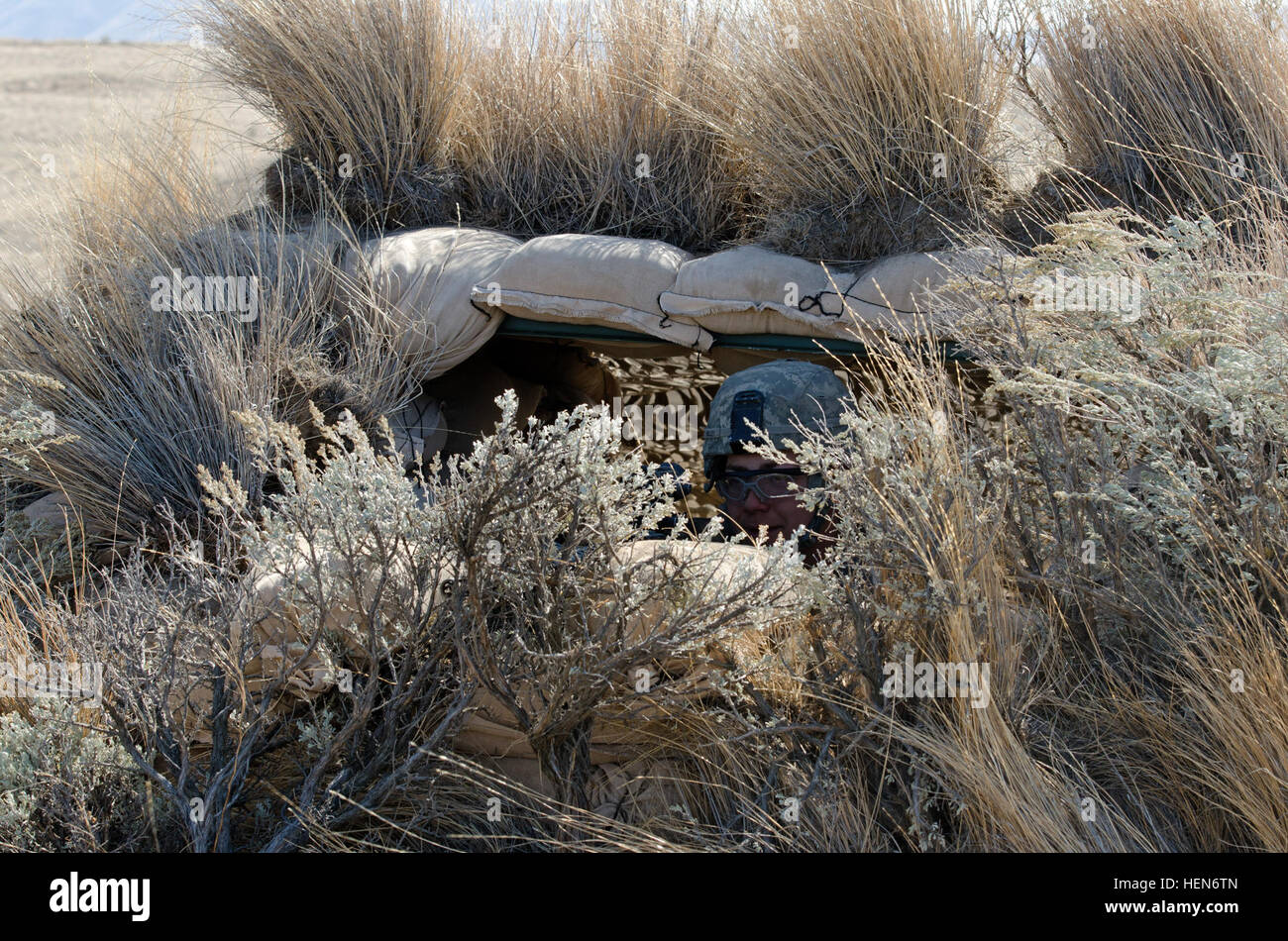 Spc. Caleb Willey, of Davenport, Iowa, keeps a lookout from his ...