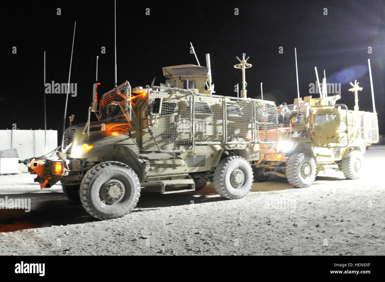 A pair of Mine Resistant Ambush Protected Vehicles with tow lines all ...
