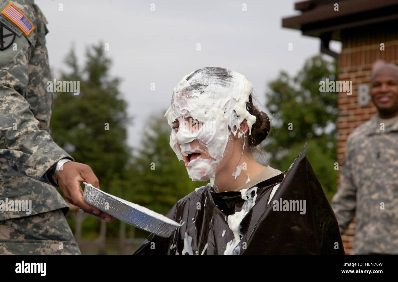 U.S. Army Sgt. Julie Jaeger smiles with whipped cream on her face ...