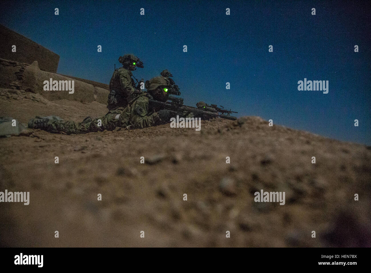 Coalition force members rear security during an operation in Helmand ...
