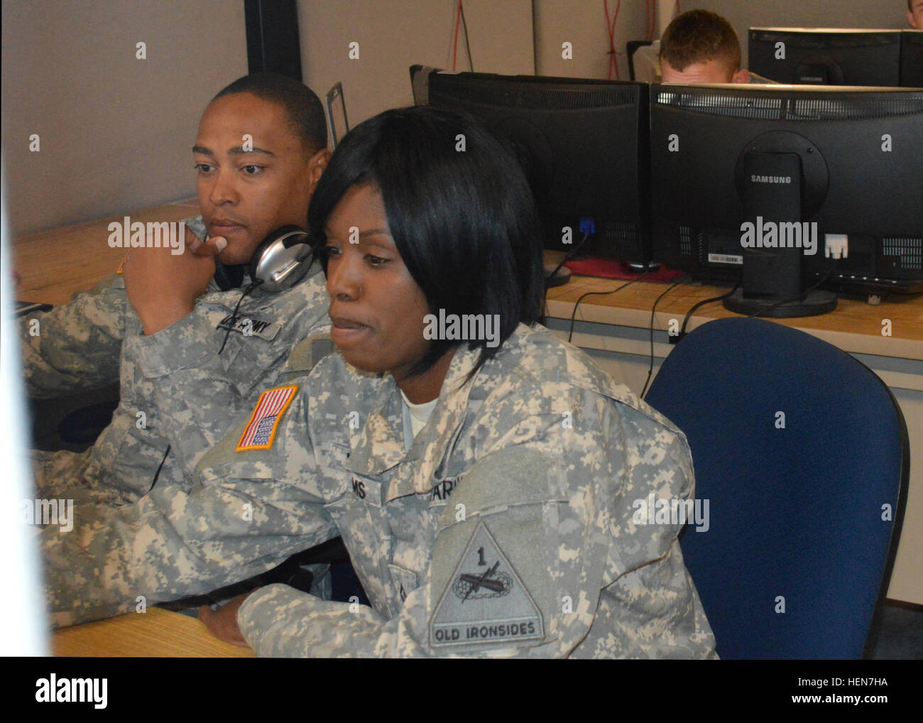 Spc. Steven V. Tyler (left), a Wheeled Vehicle Mechanic and Pfc. Kristy ...