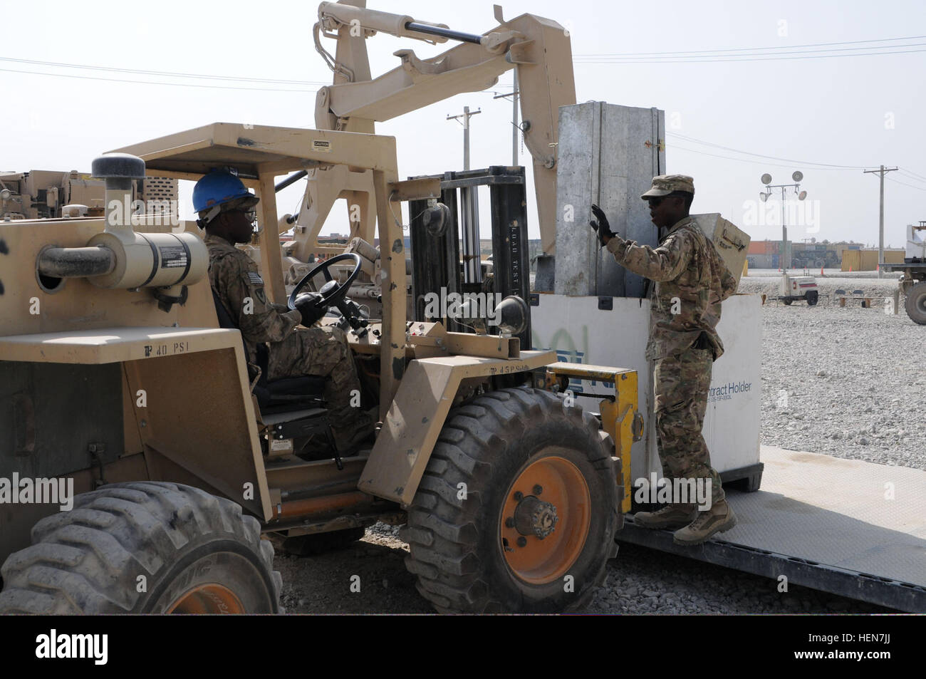 U.S. Army Pfc. Jordan Hunter, right, a motor transport operator with ...