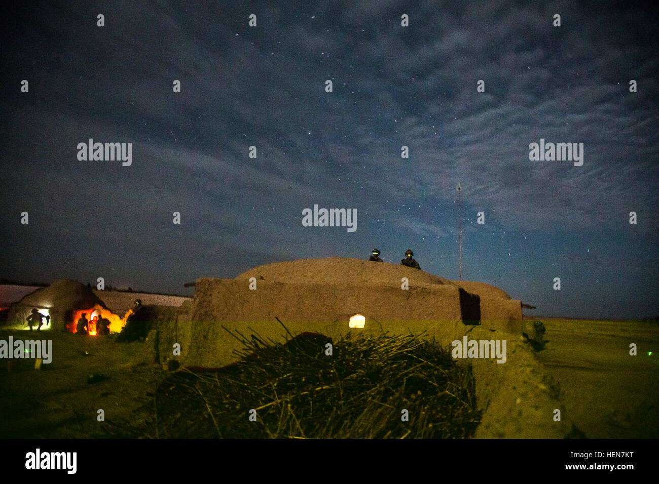 Coalition force members provide security during an operation in Helmand ...