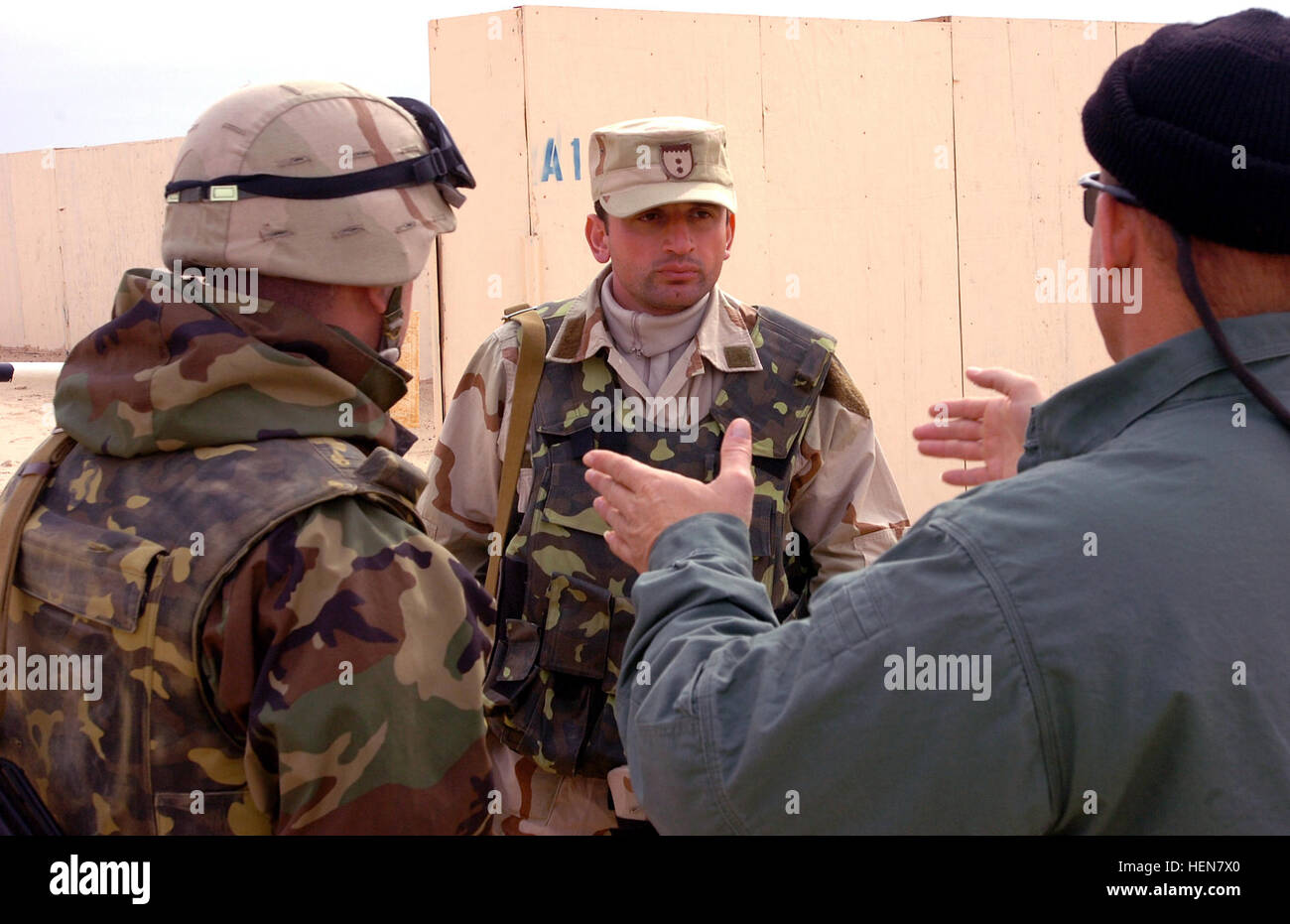 An MPRI instructor discusses security search procedures with two ...