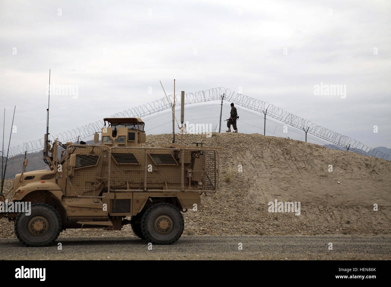 An Afghan National Army (ANA) soldier pulls overwatch security during a ...