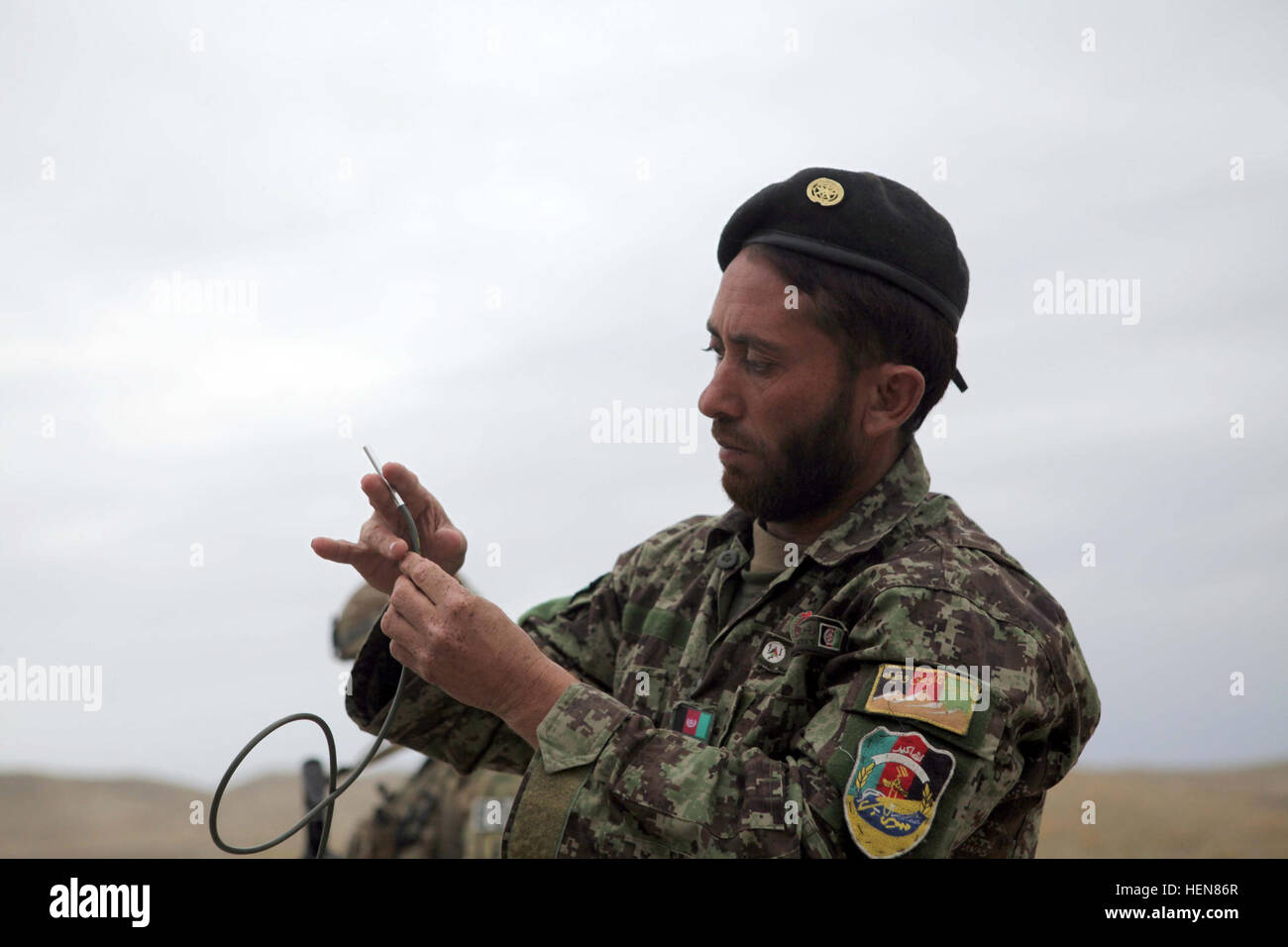 An Afghan National Army soldier examines a time fuse during a training ...