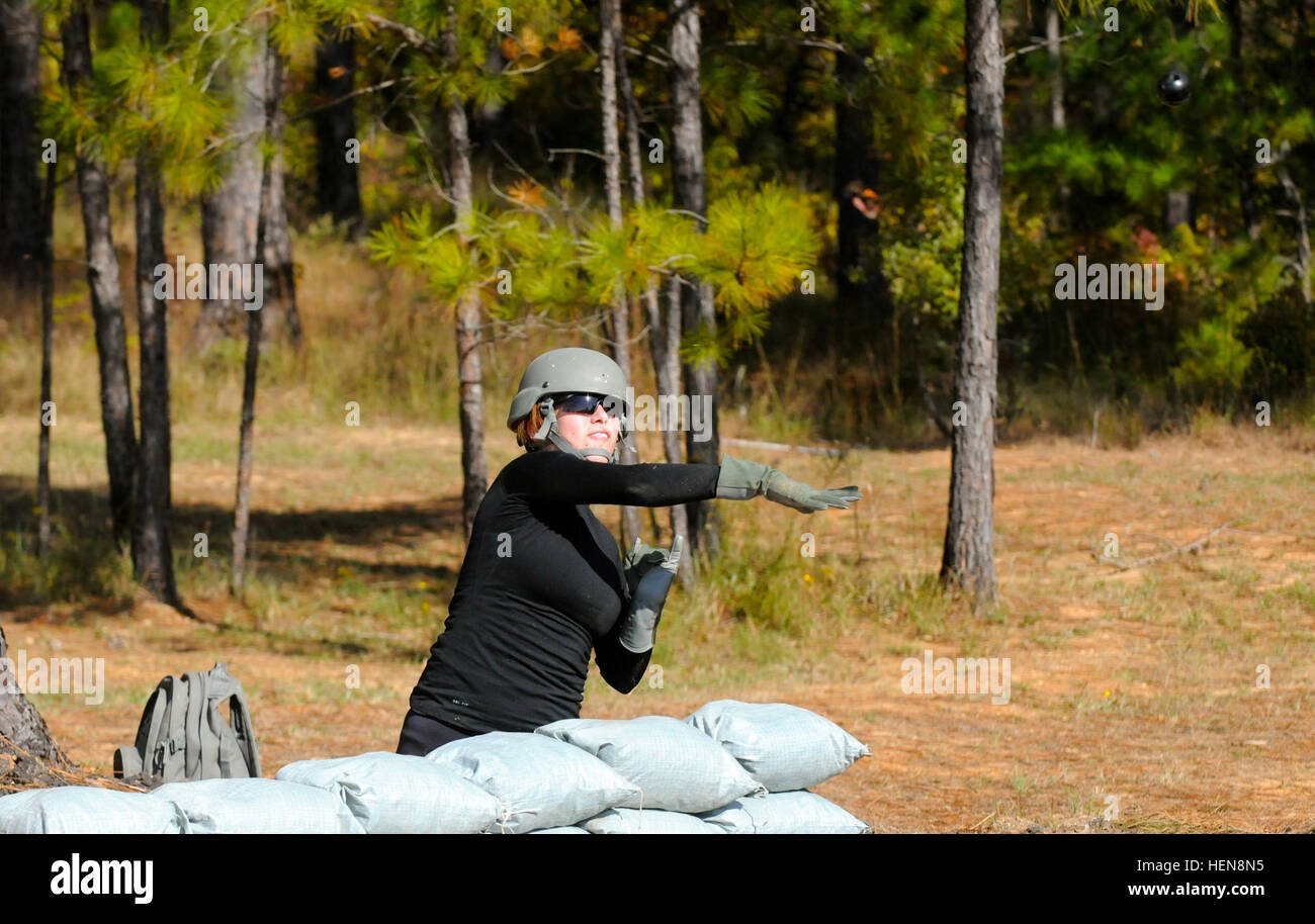 U.S. Army spouse Daniela Ruano throws a dummy grenade during the Jane ...
